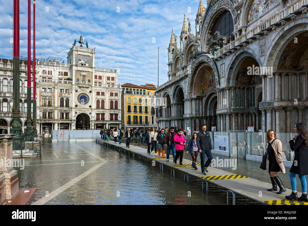 People walking on elevated platforms during an Acqua alta (high water ...