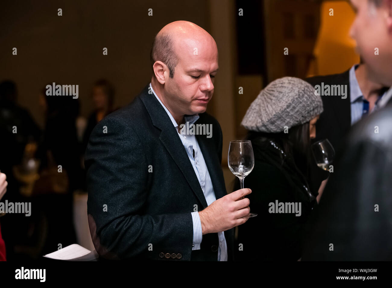 Johannesburg, South Africa - May 10 2013: Sophisticated people sampling ...