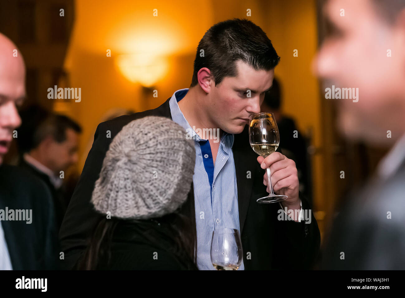 Johannesburg, South Africa - May 10 2013: Sophisticated people sampling ...