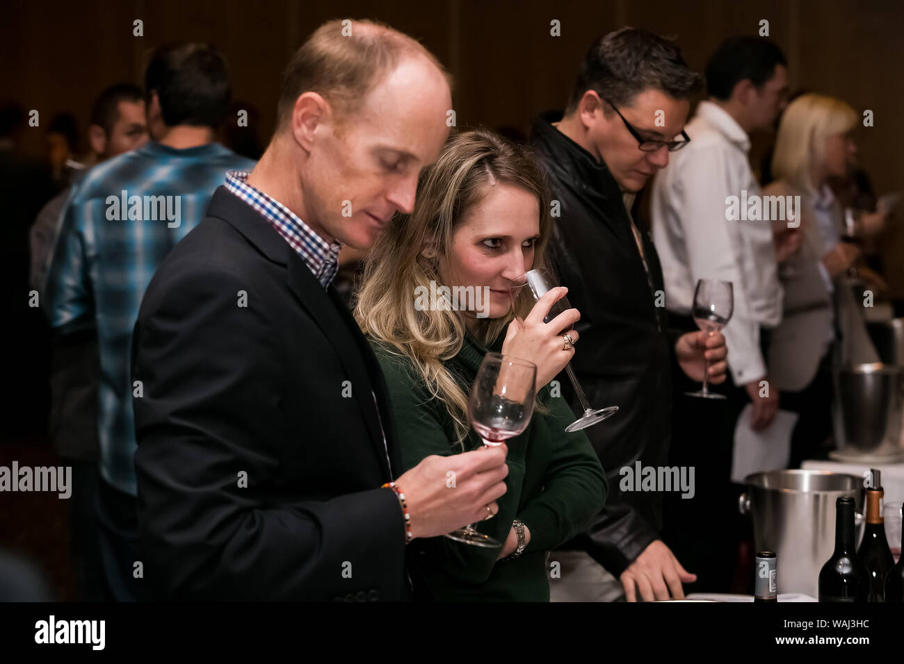 Johannesburg, South Africa - May 10 2013: Sophisticated people sampling ...