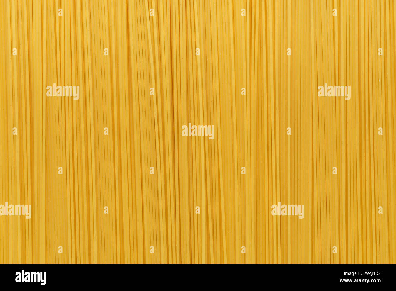 Dry uncooked spaghetti pasta as a background. Flat lay Stock Photo - Alamy
