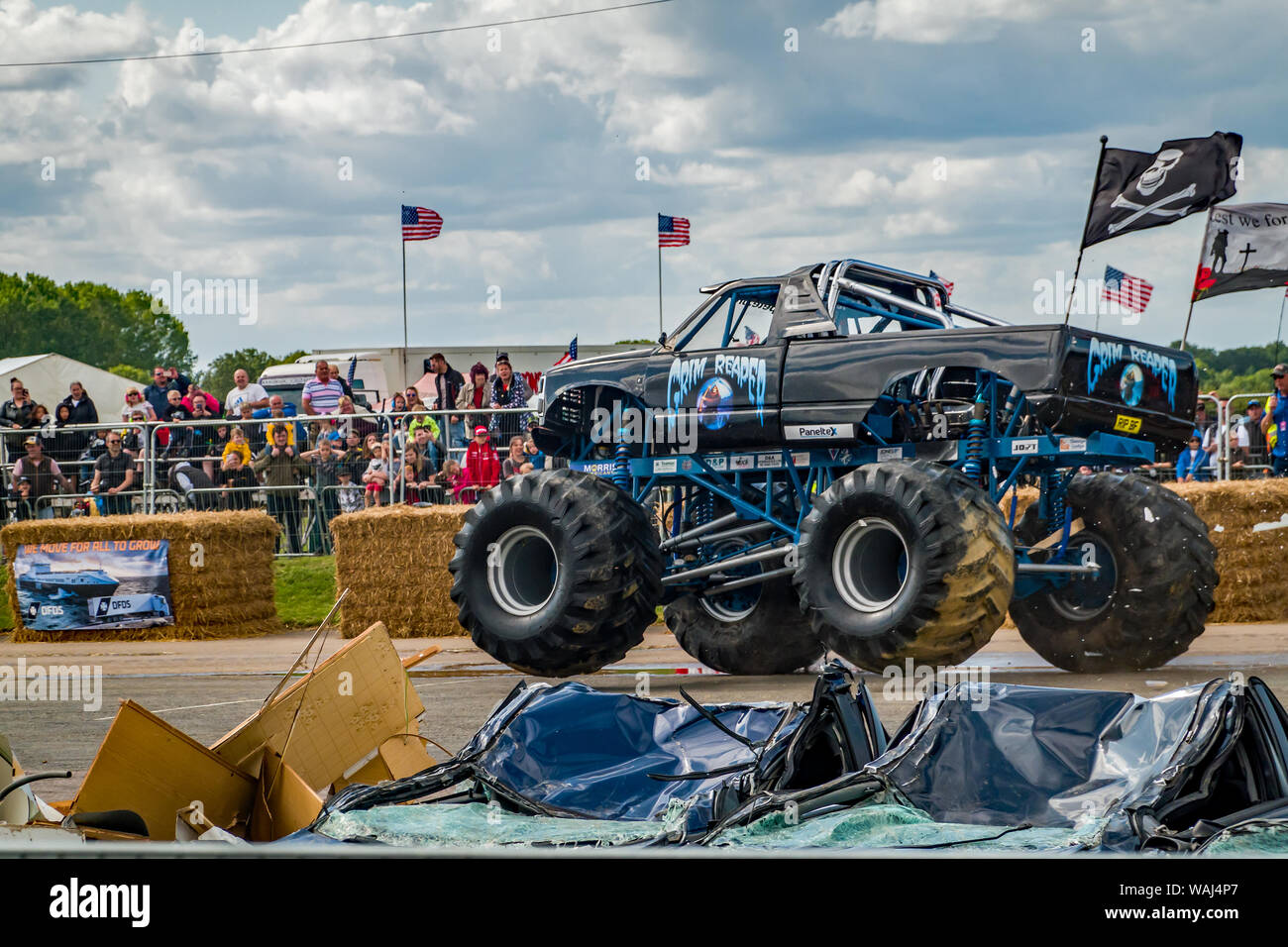 The Grim Reaper monster truck air borne whilst jumping over a stack of ...