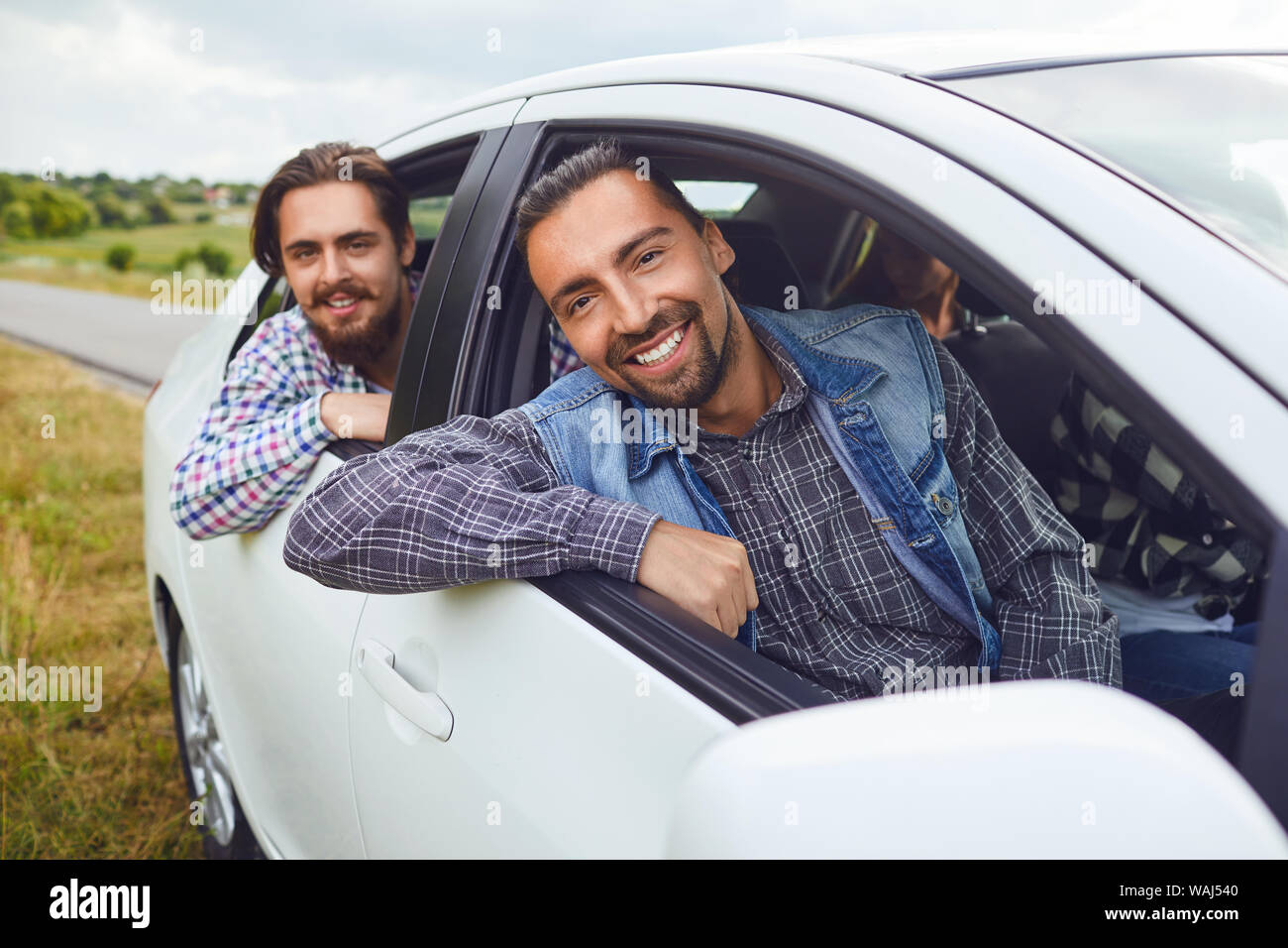 Happy men and car hi-res stock photography and images - Alamy