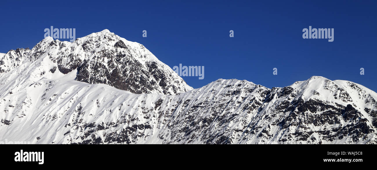Snowy mountains and blue clear sky at cold winter day. Caucasus ...