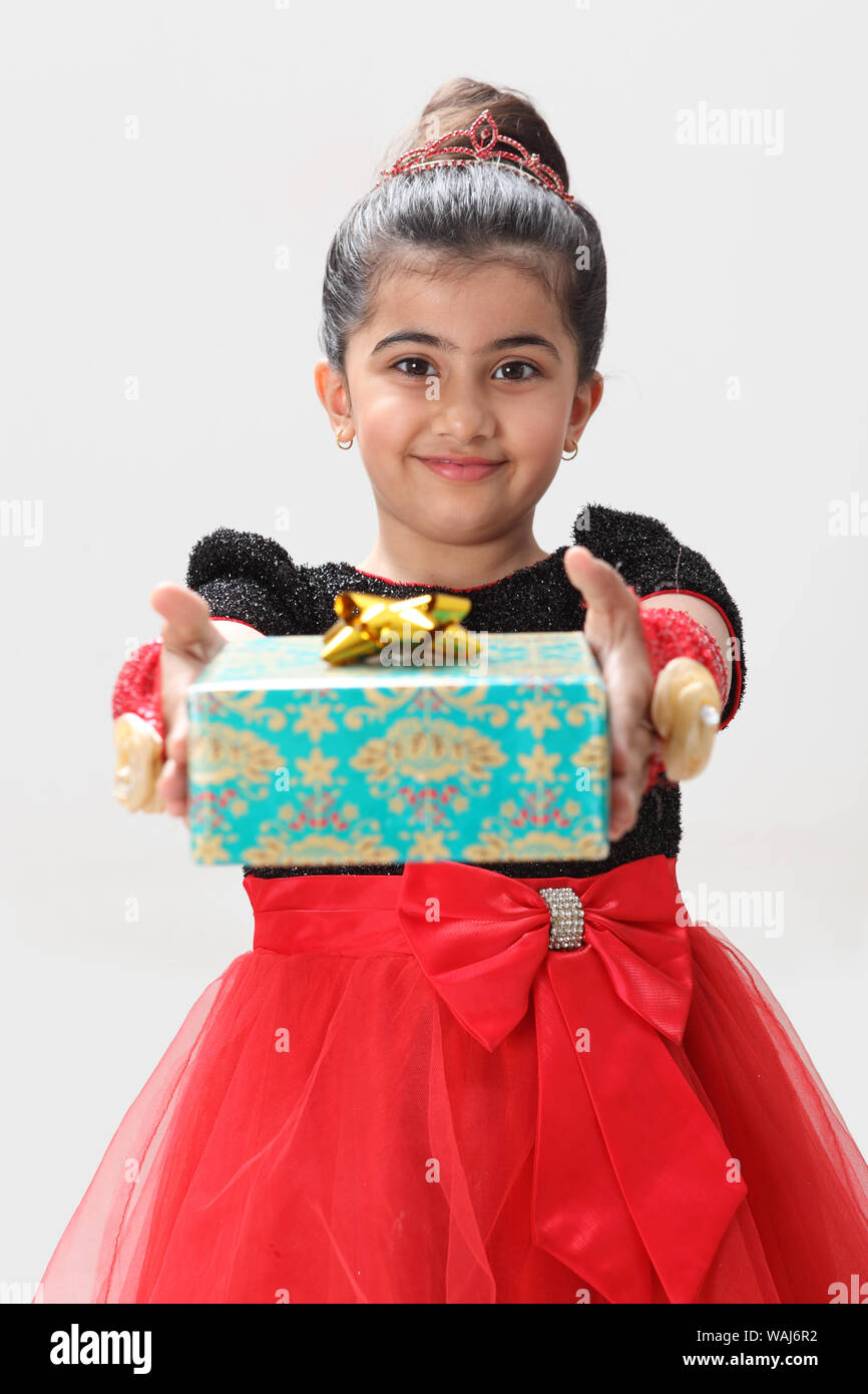 Girl holding small gift hi-res stock photography and images - Alamy