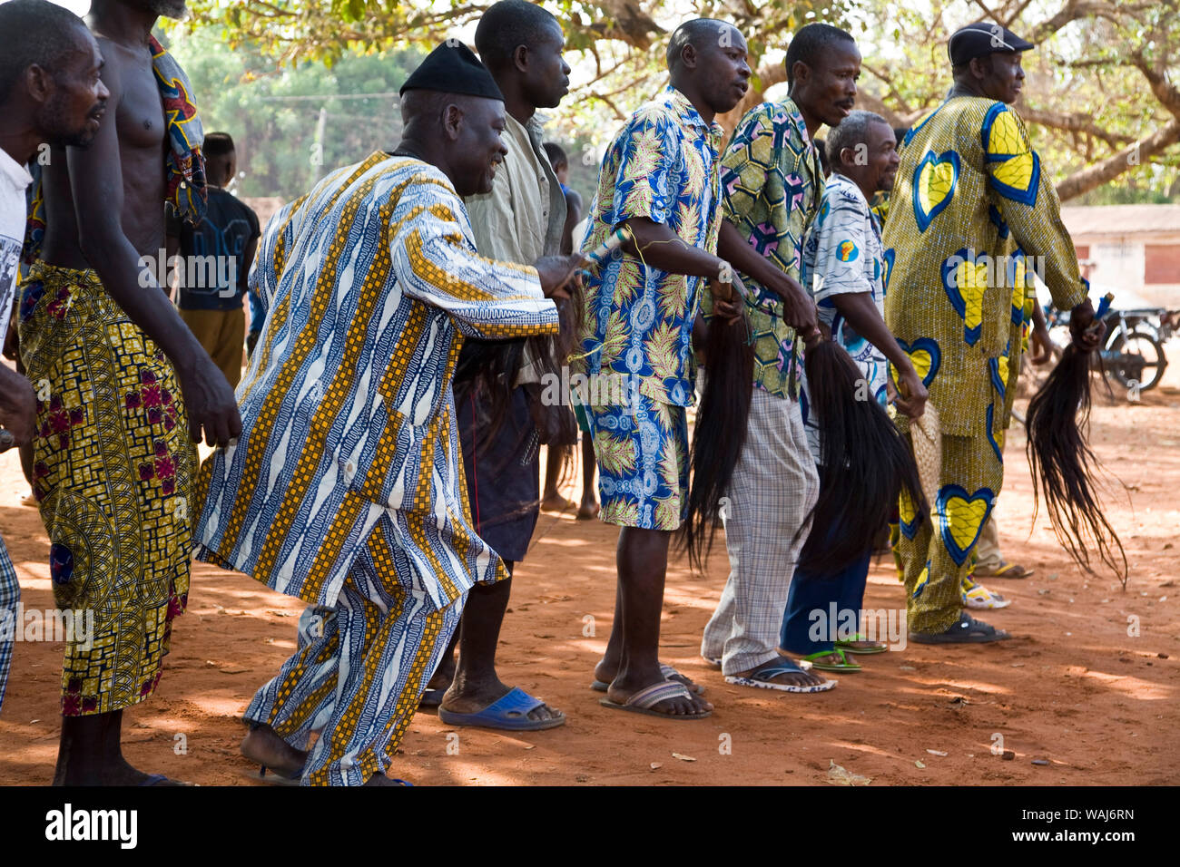 West Africa, Benin. Men dancing in line before Gelede Mask Dance Stock ...