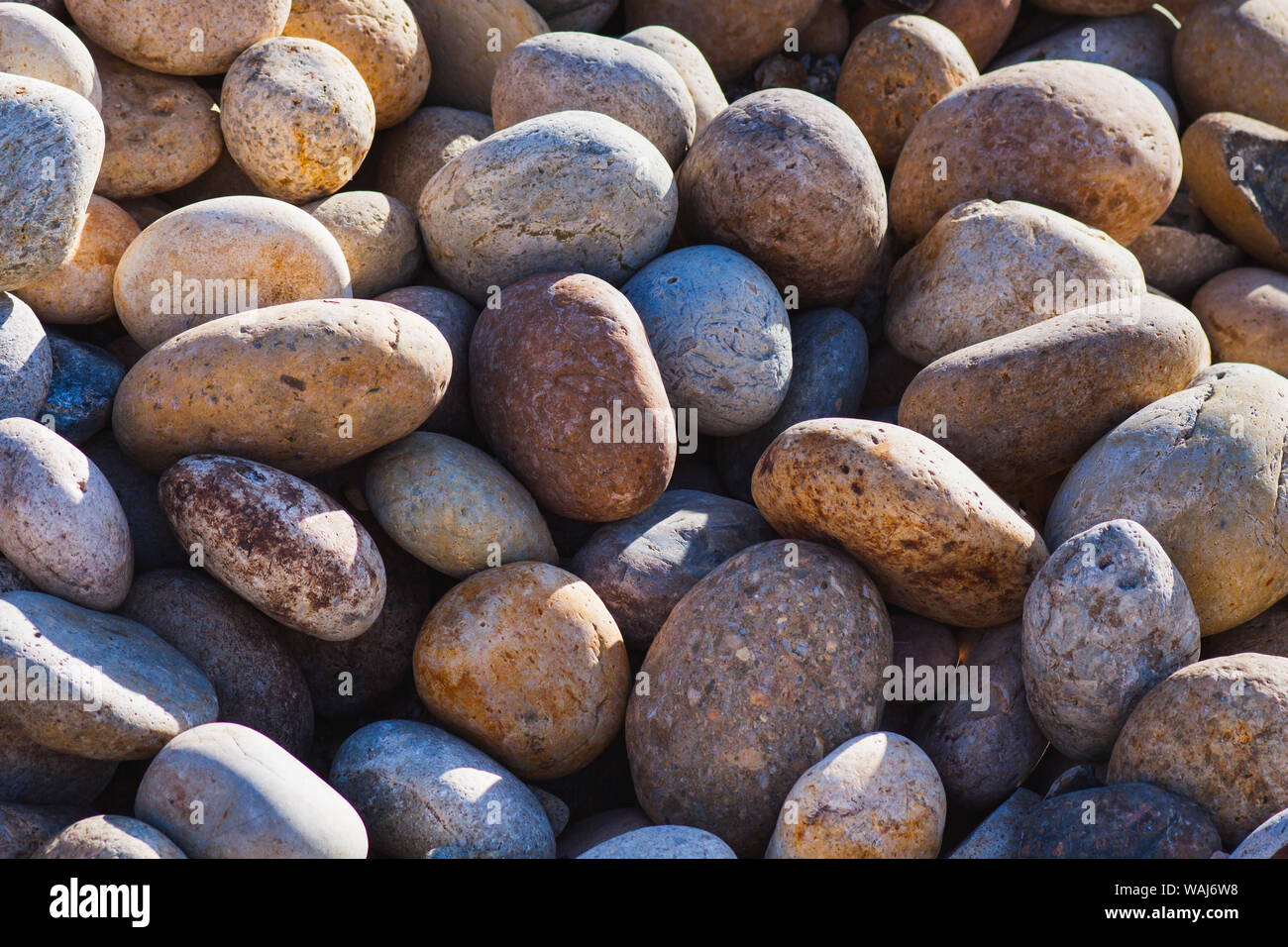 Polished river rocks Stock Photo - Alamy