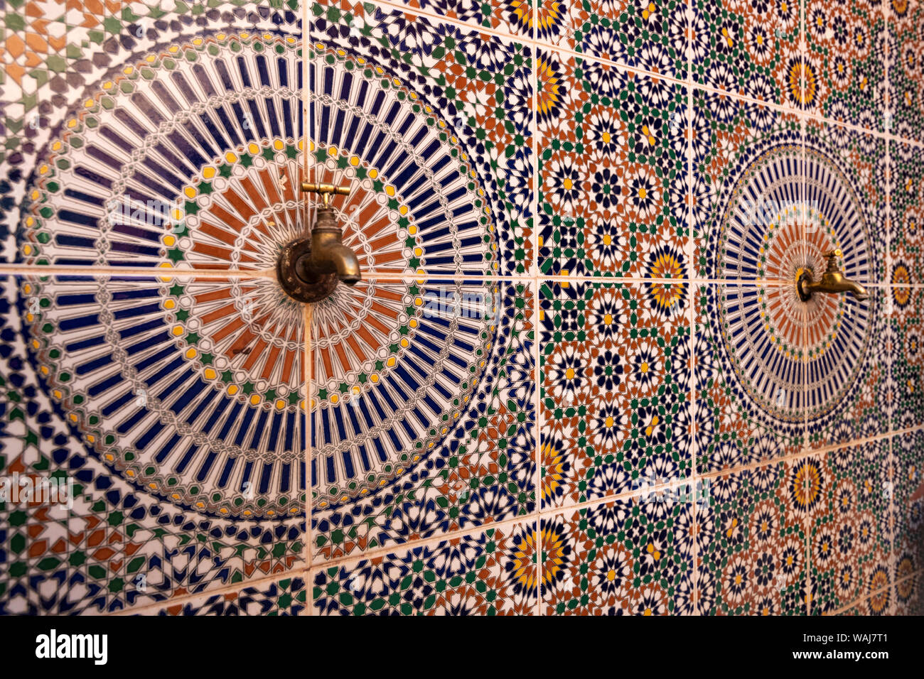 Africa, Morocco. Close-up of tile design patterns around faucets ...