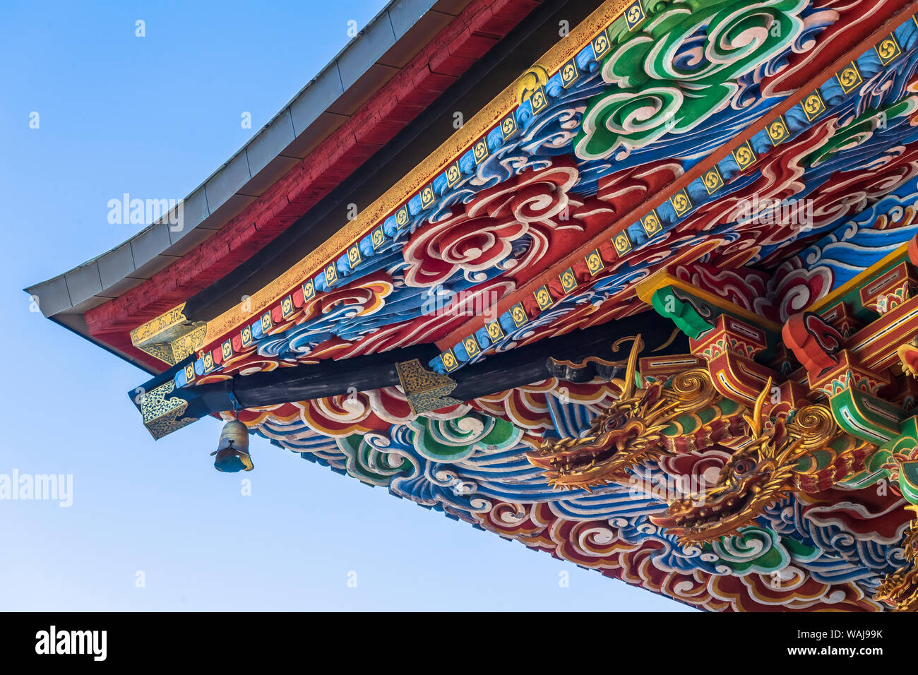 Close-up view of the decorative and colorful roof corner of a temple ...