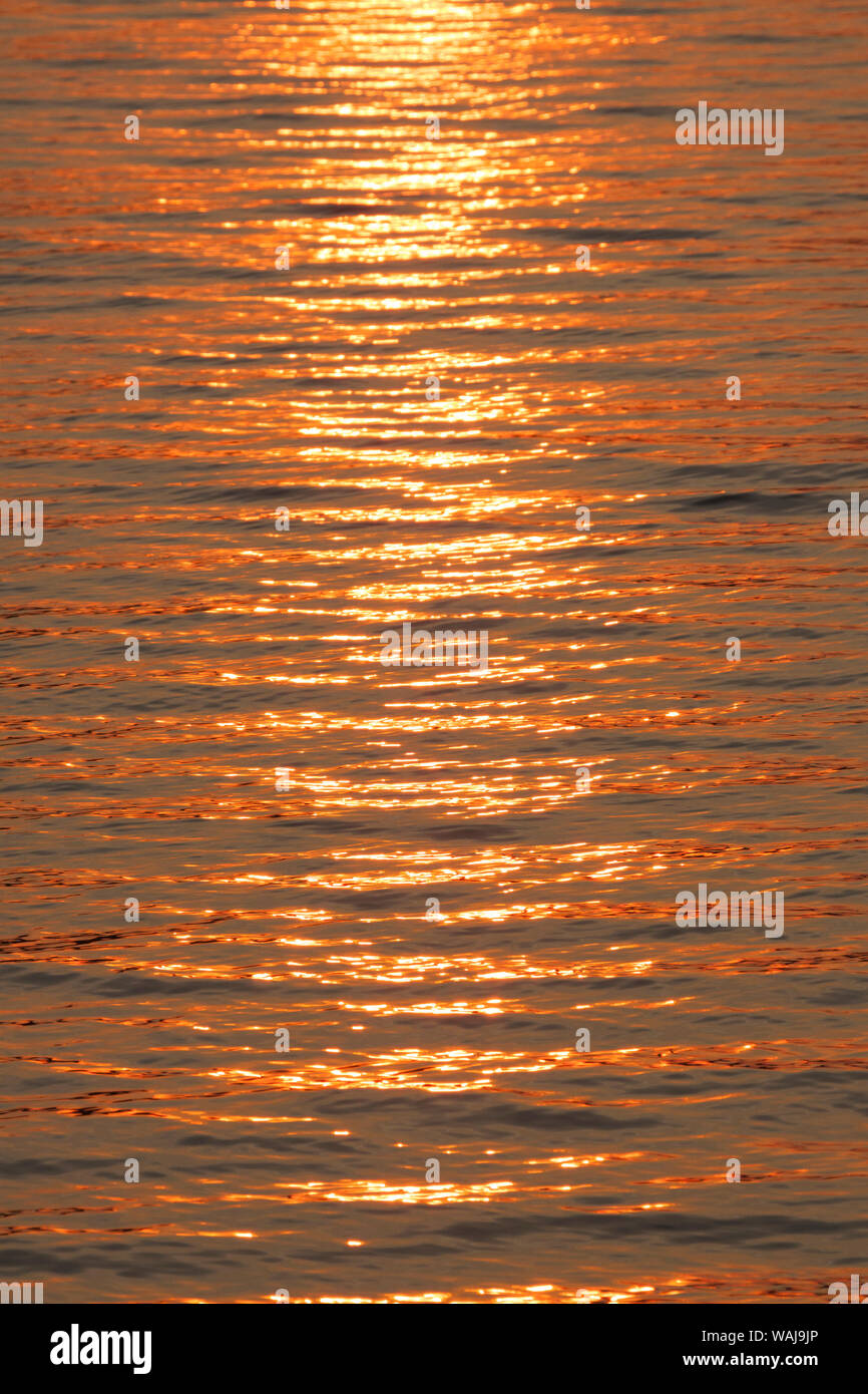 Sunset reflections on ripples of water Stock Photo - Alamy