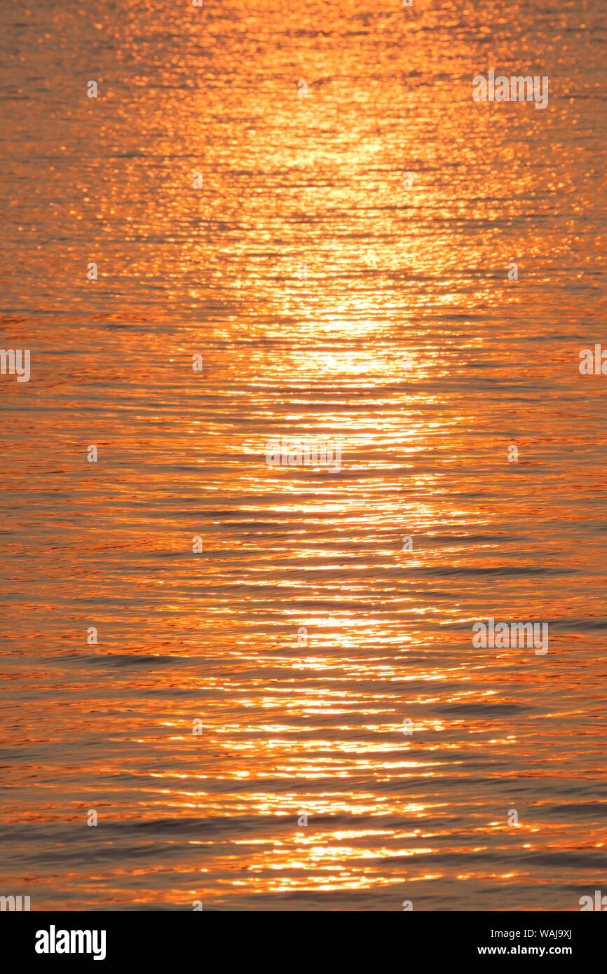 Sunset reflections on ripples of water Stock Photo - Alamy