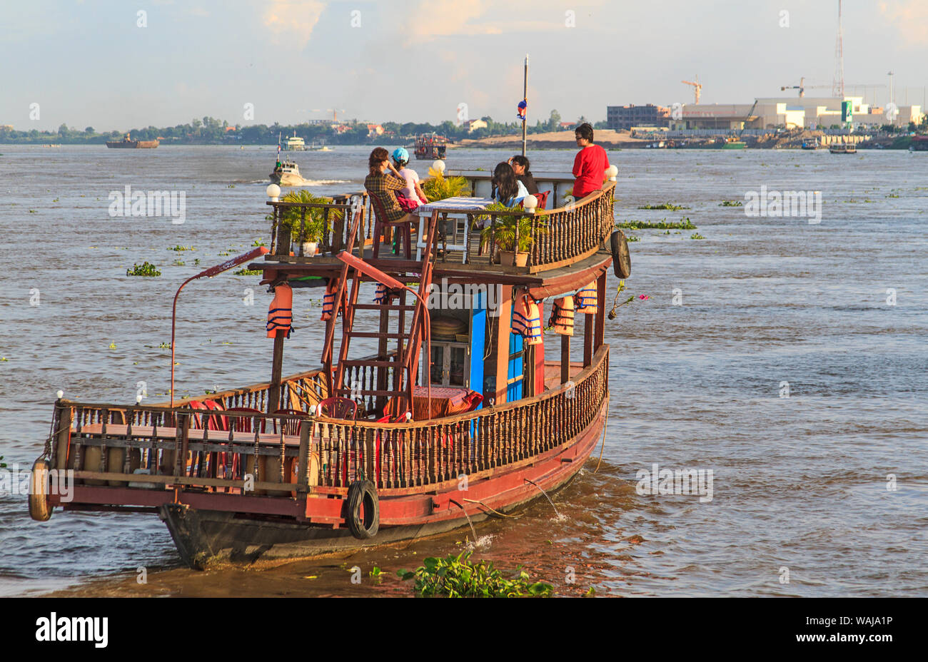 Phnom Penh, Cambodia. Tourist boats on Mekong River during sunset ...