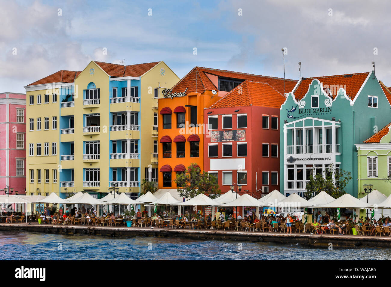 Lesser Antilles, Curacao, Willemstad. People relaxing along the ...
