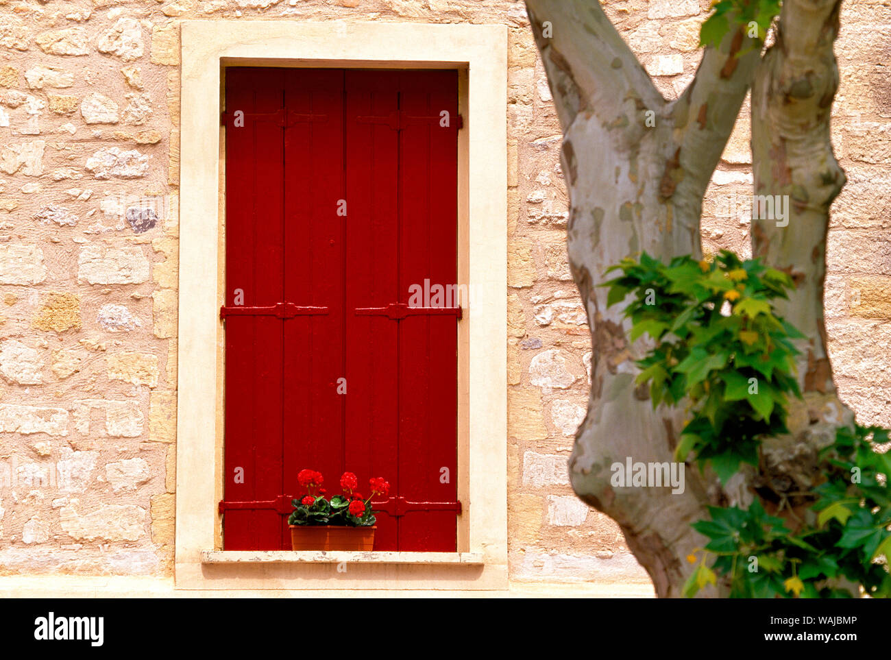 Dark red shutters in the wall of a house in France Stock Photo - Alamy