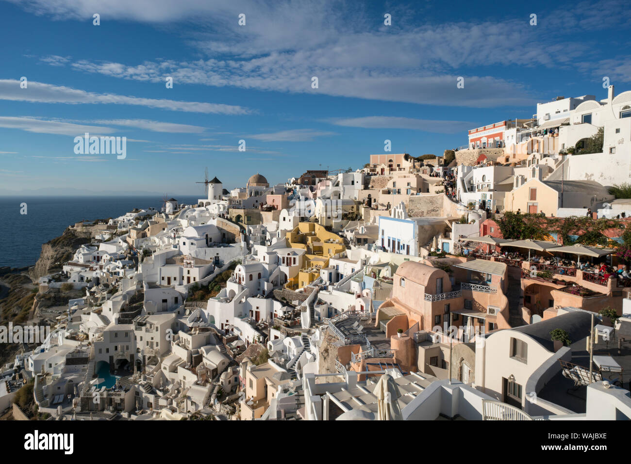 Greece, Santorini. The village of Oia glowing in the afternoon light ...