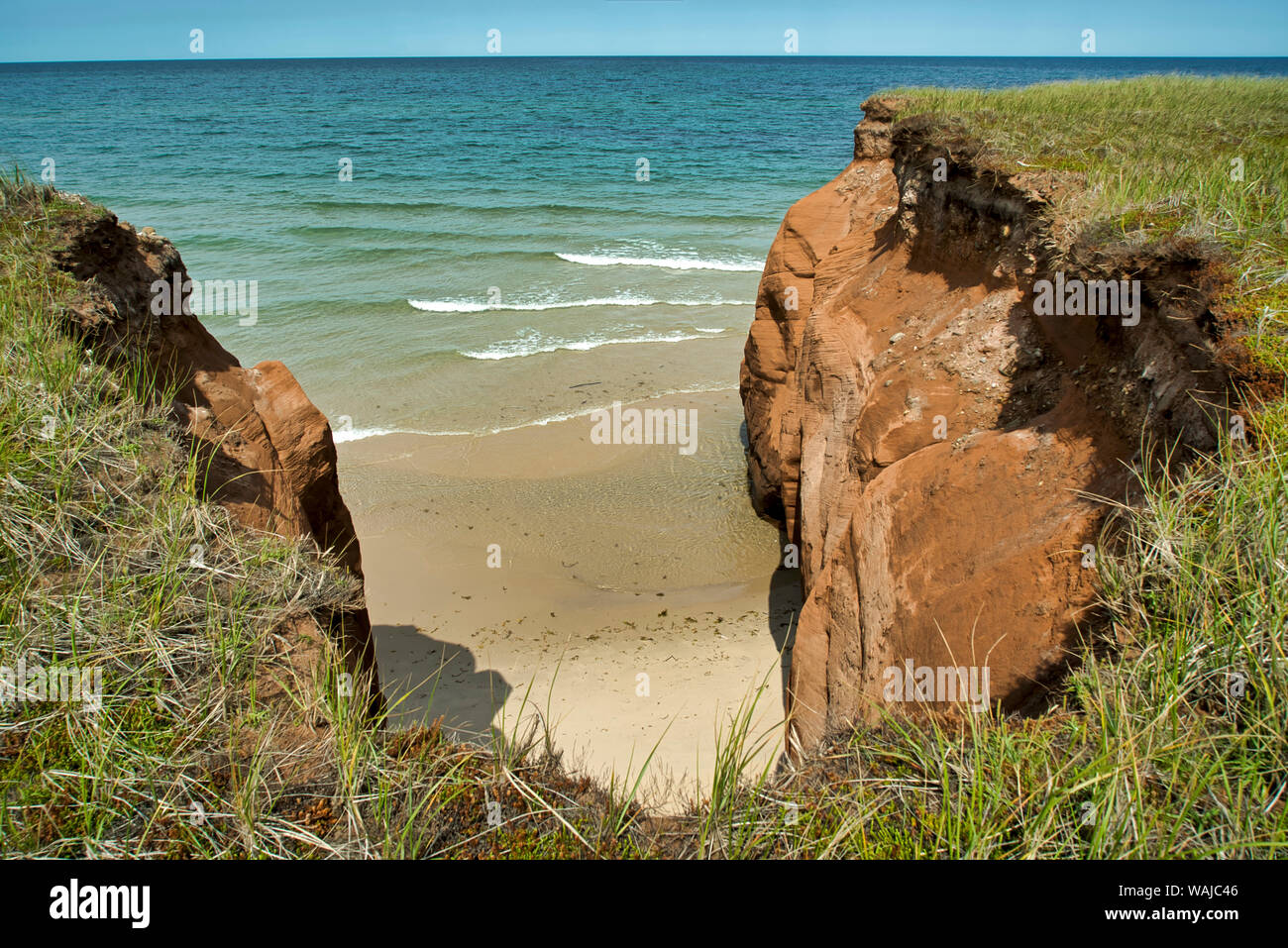 Canada, Quebec, Iles-de-la-Madeleine. Red cliff and beach Stock Photo ...