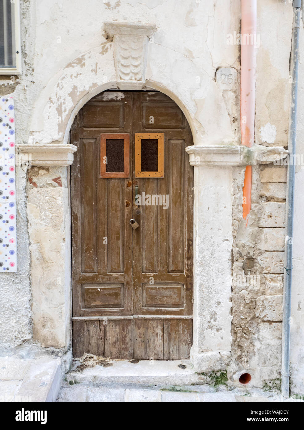 Old wooden door along the streets of Vieste Stock Photo - Alamy