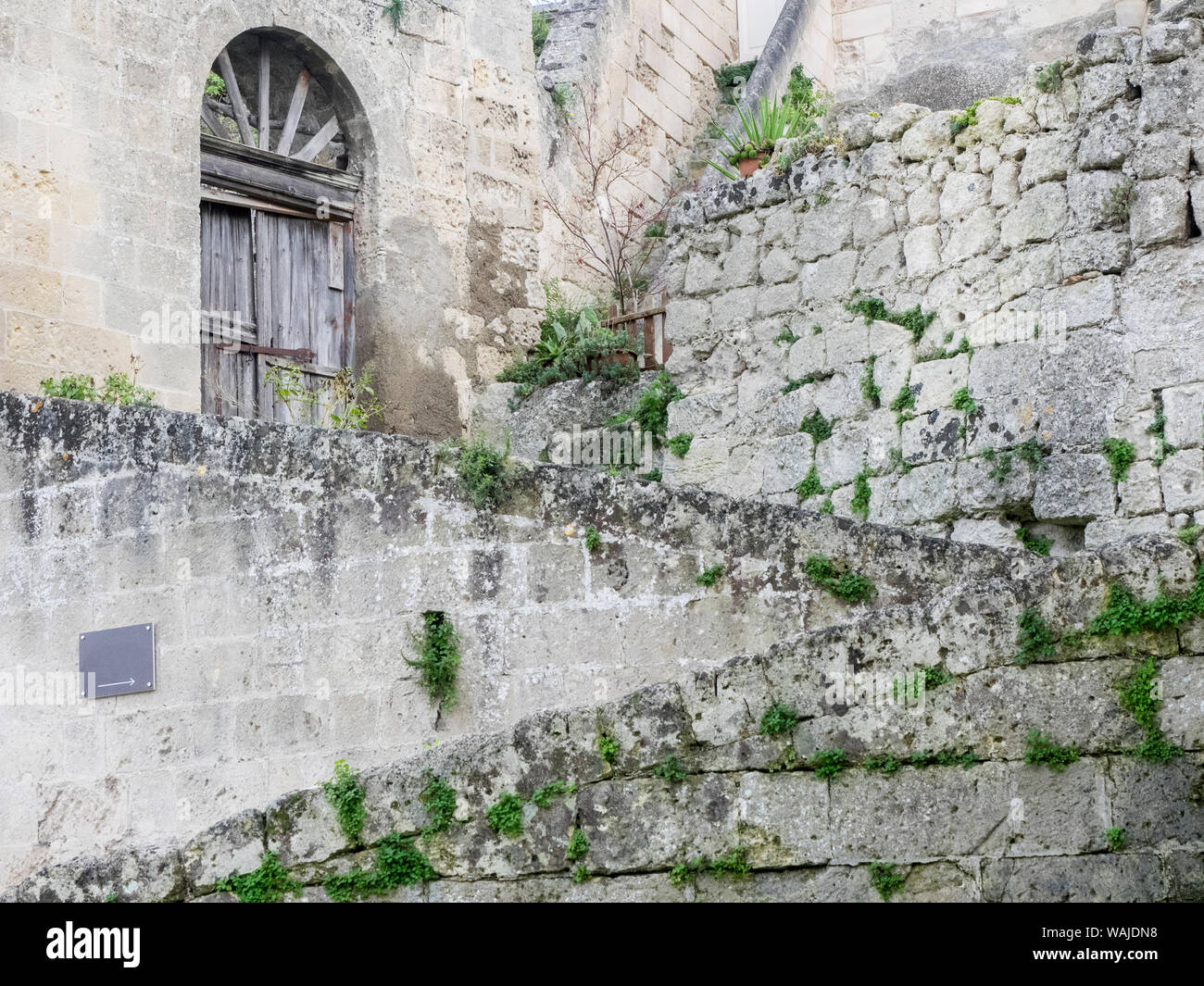 Cobblestone steps leading to the entrance of a Sassi home in the old ...