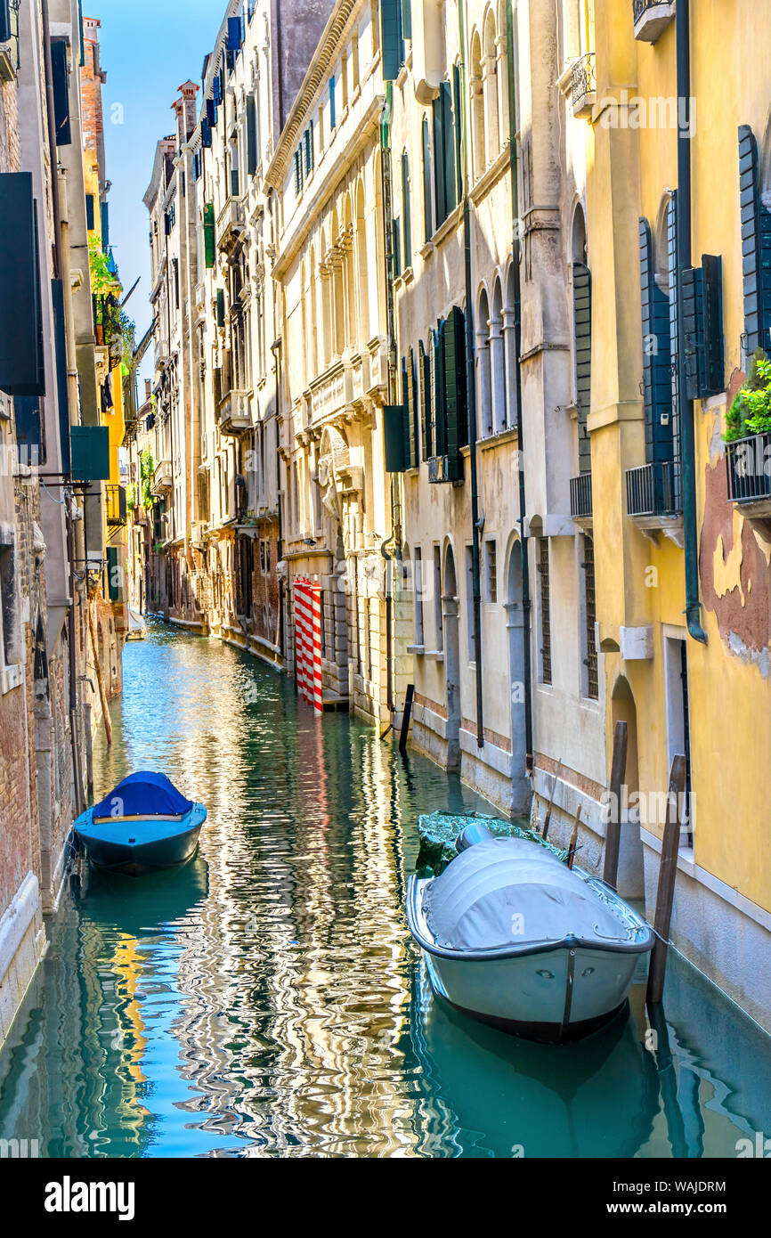 Colorful buildings and poles reflection, Venice, Italy Stock Photo - Alamy