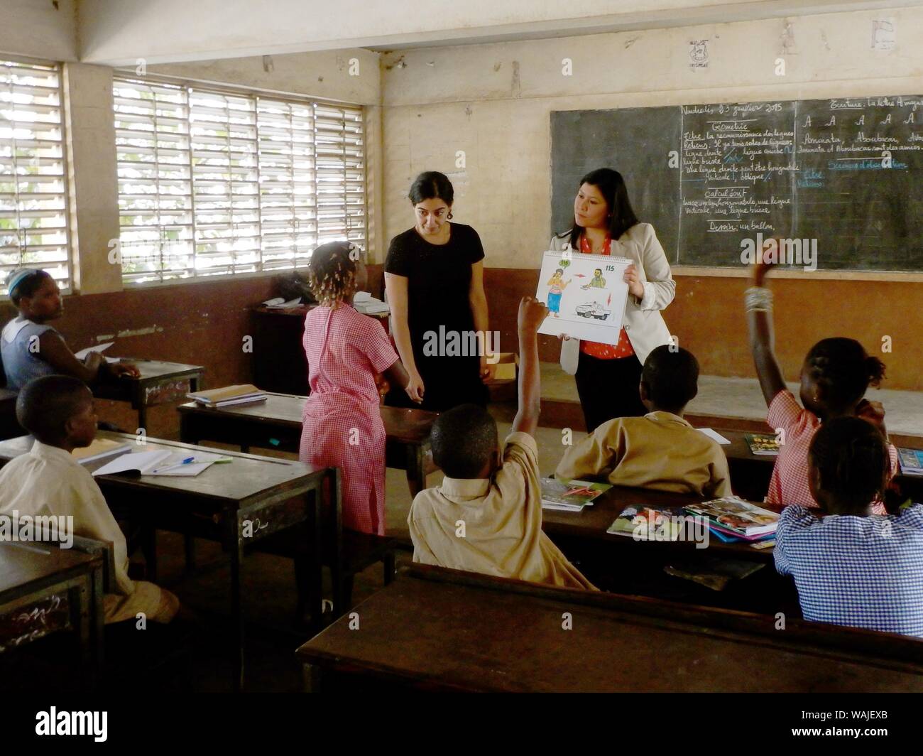 2015 - CDC staff members speaking to school students in Conakry Guinea ...
