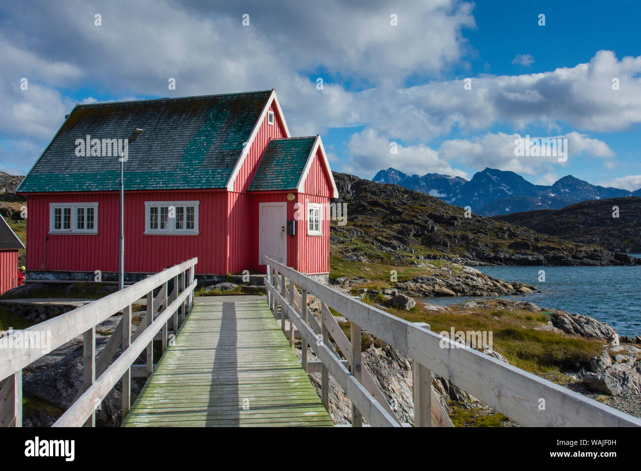 Greenland. Itilleq. Wooden bridge leading to a red house Stock Photo ...