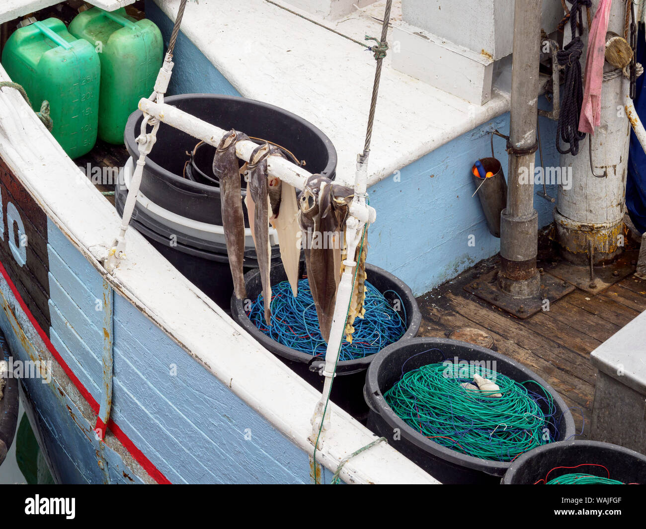 Bucket with lines and hooks for longline fishing. The harbor in town ...