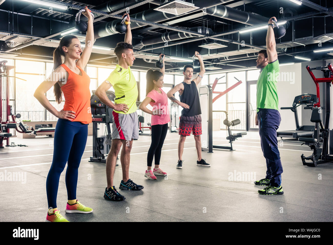 People taking training from gym trainer Stock Photo - Alamy