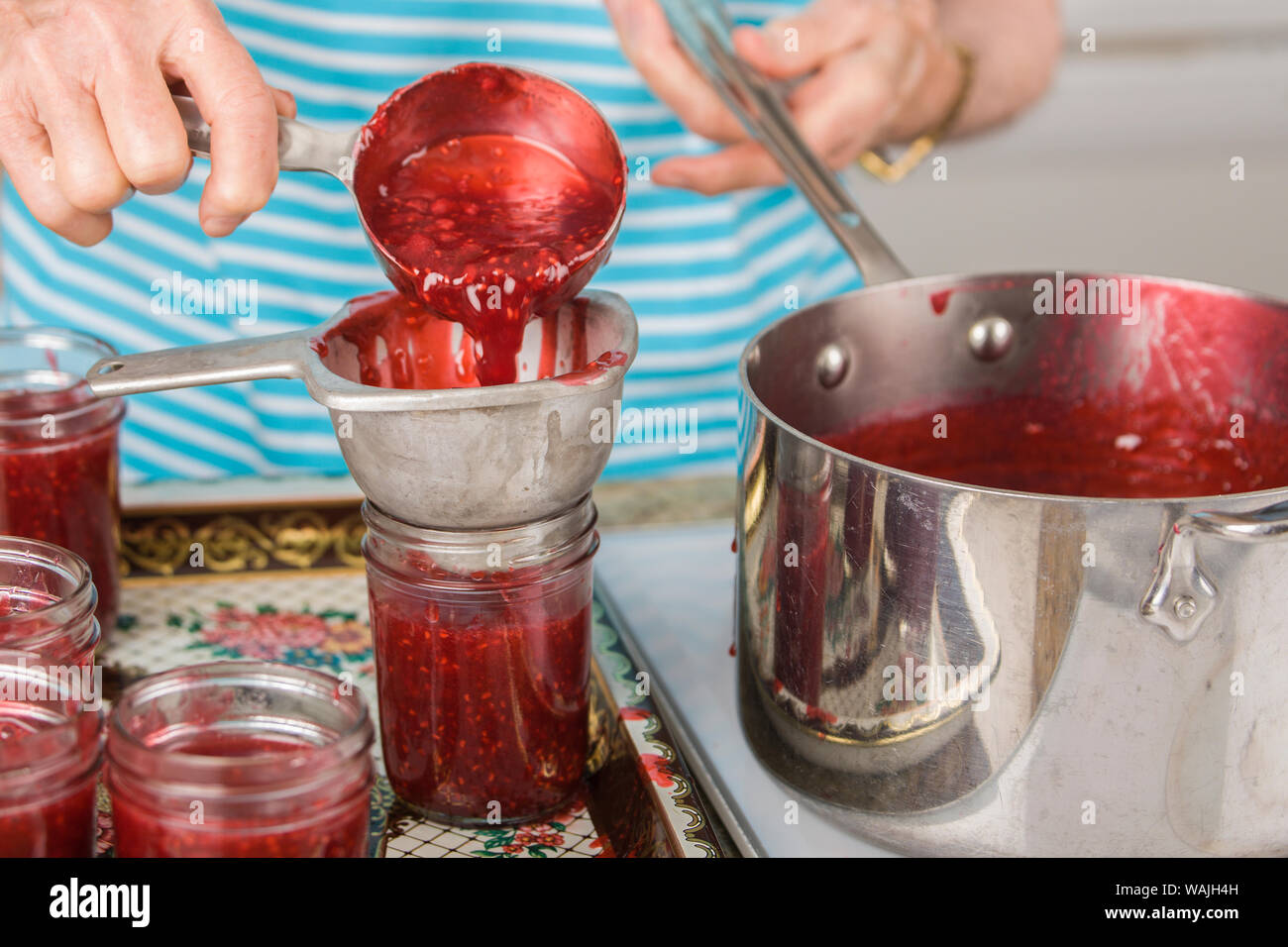 Person filling jam glass hi-res stock photography and images - Alamy