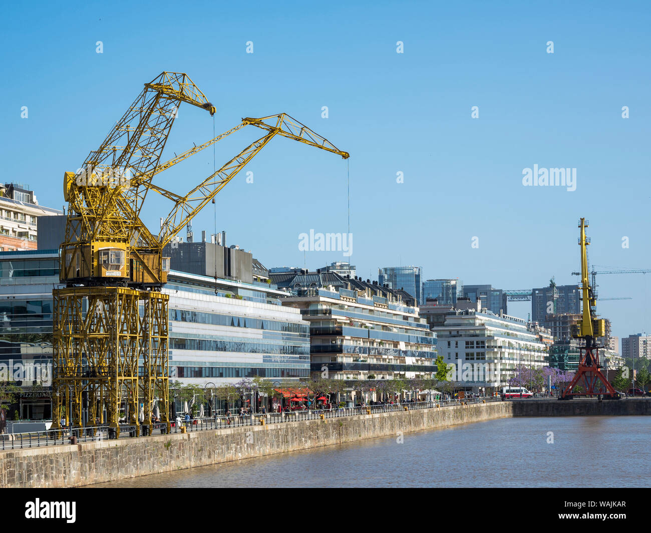 The old cranes at the old docks. Puerto Madero, the modern living ...