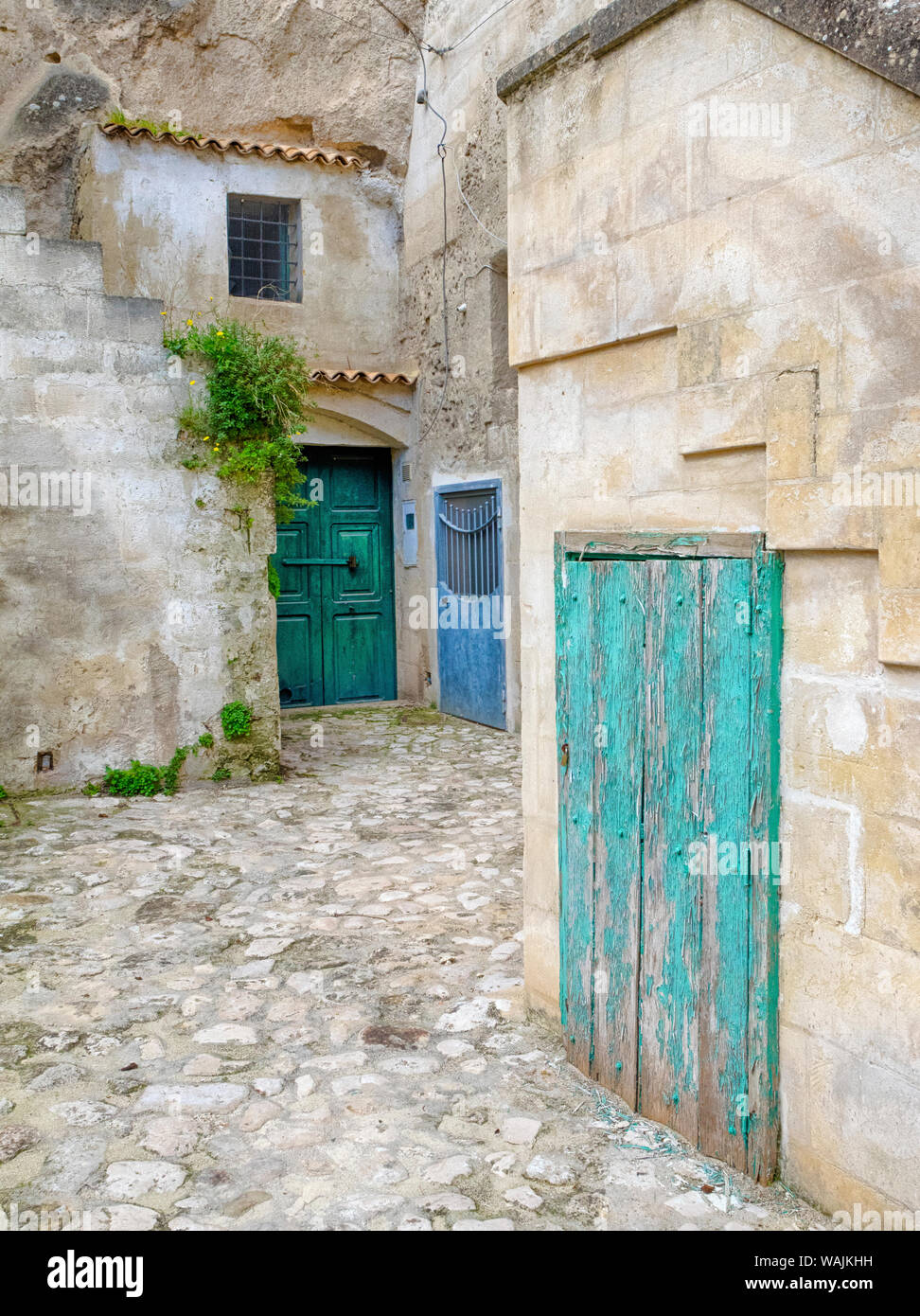 Italy, Basilicata, Matera. Doors in a courtyard in the old town of ...