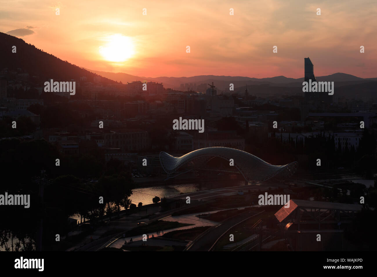 Beautiful view of glass Bridge of Peace in old Tbilisi at sunset ...
