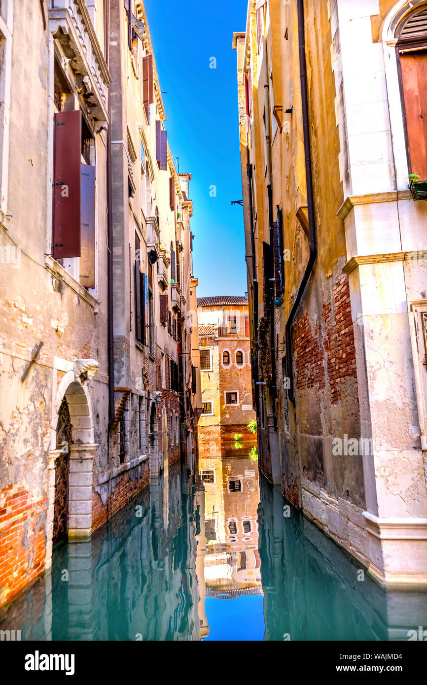 Colorful small canal building reflection, Venice, Italy Stock Photo - Alamy