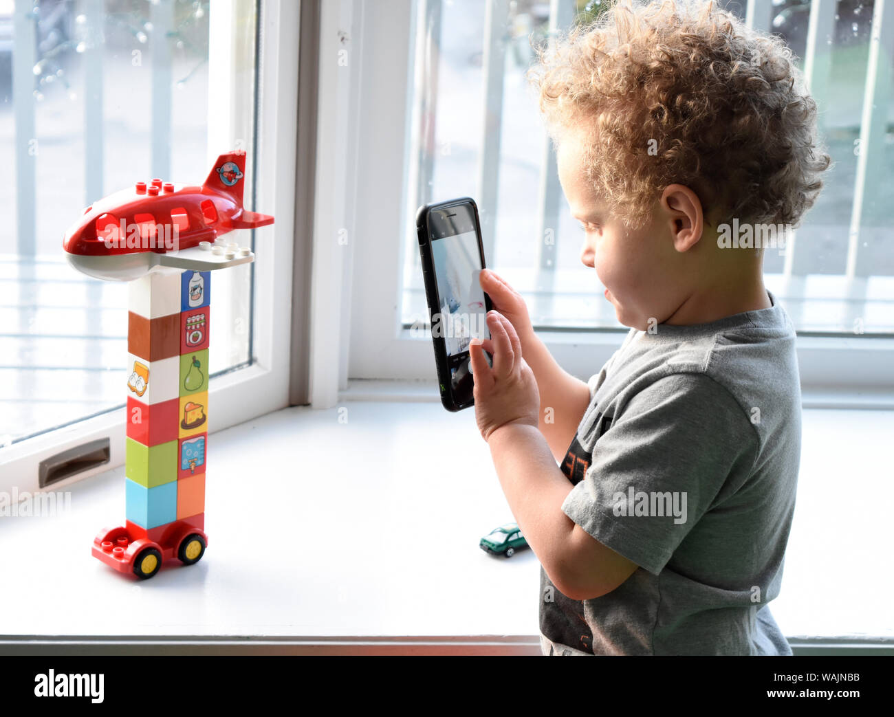 Boy with cell hi-res stock photography and images - Alamy