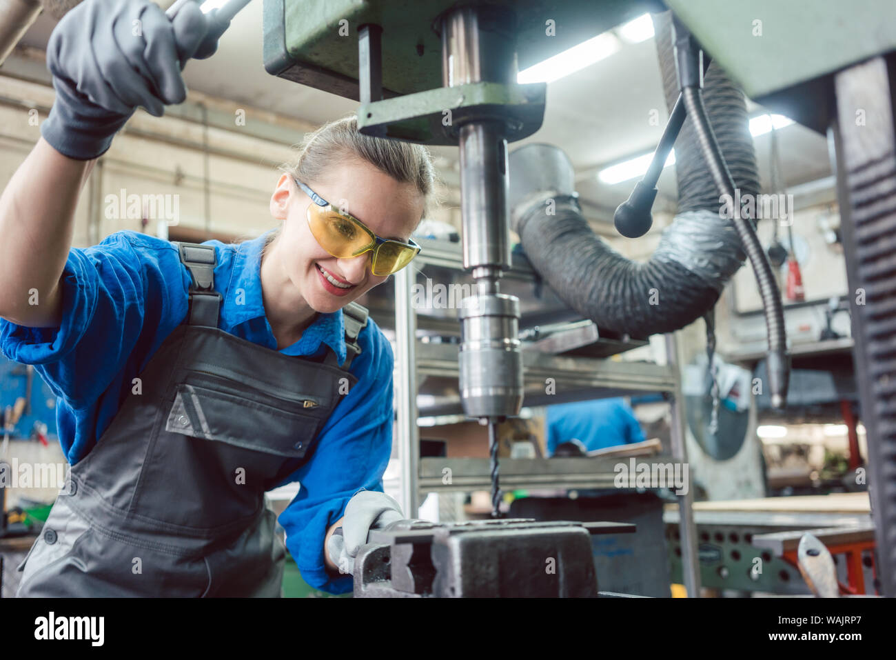 Woman using power drill hi-res stock photography and images - Alamy
