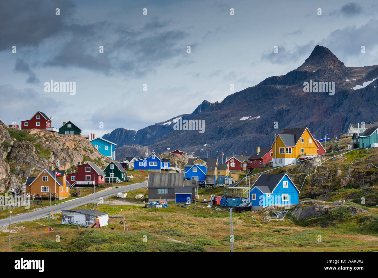 Greenland, Sisimiut. Nasaasaaq mountain towering above colorful ...