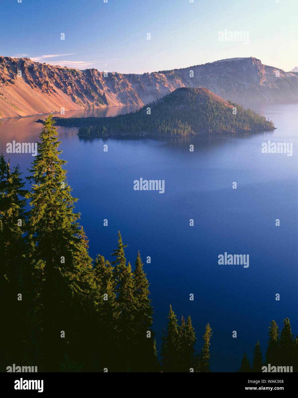 USA, Oregon, Crater Lake National Park. Sunrise on west rim of Crater ...