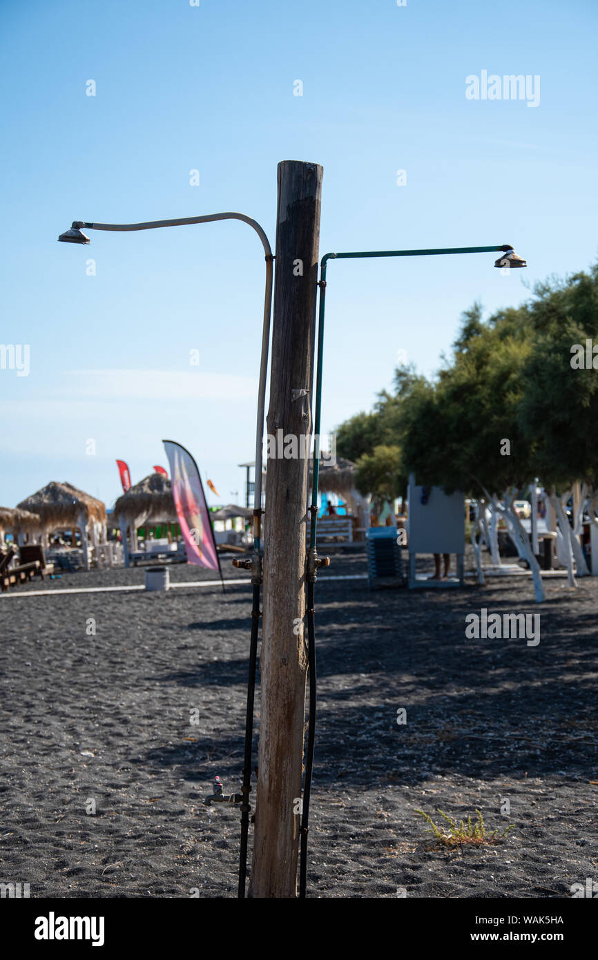Perissa, Greece - July 11 2019: A pair of showers for beach users to ...