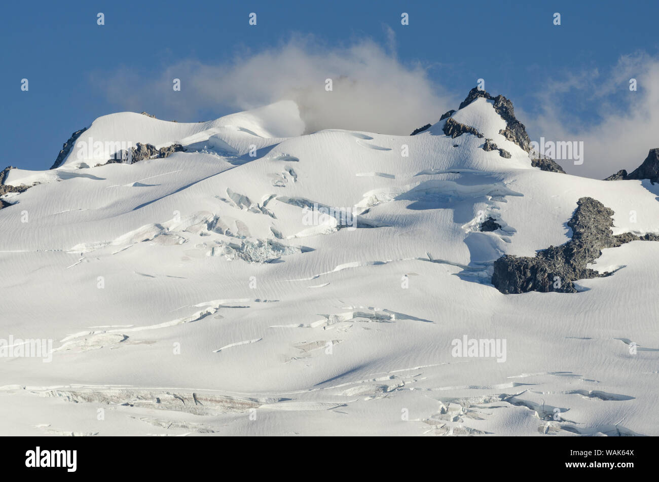 Clouds swirling around summit ridge of Mount Challenger (elevation 8236 ...
