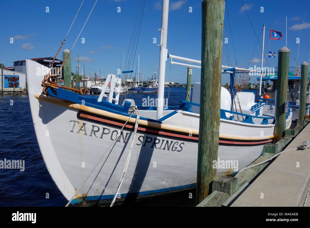 Typical sponge boat docked and offloading its haul Stock Photo - Alamy