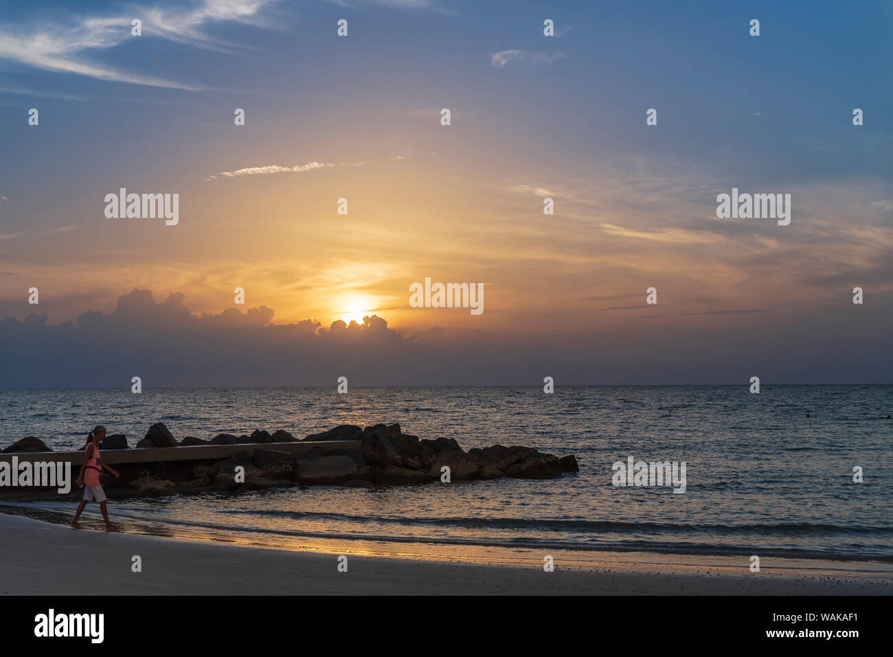 Lone one woman beach hi-res stock photography and images - Alamy