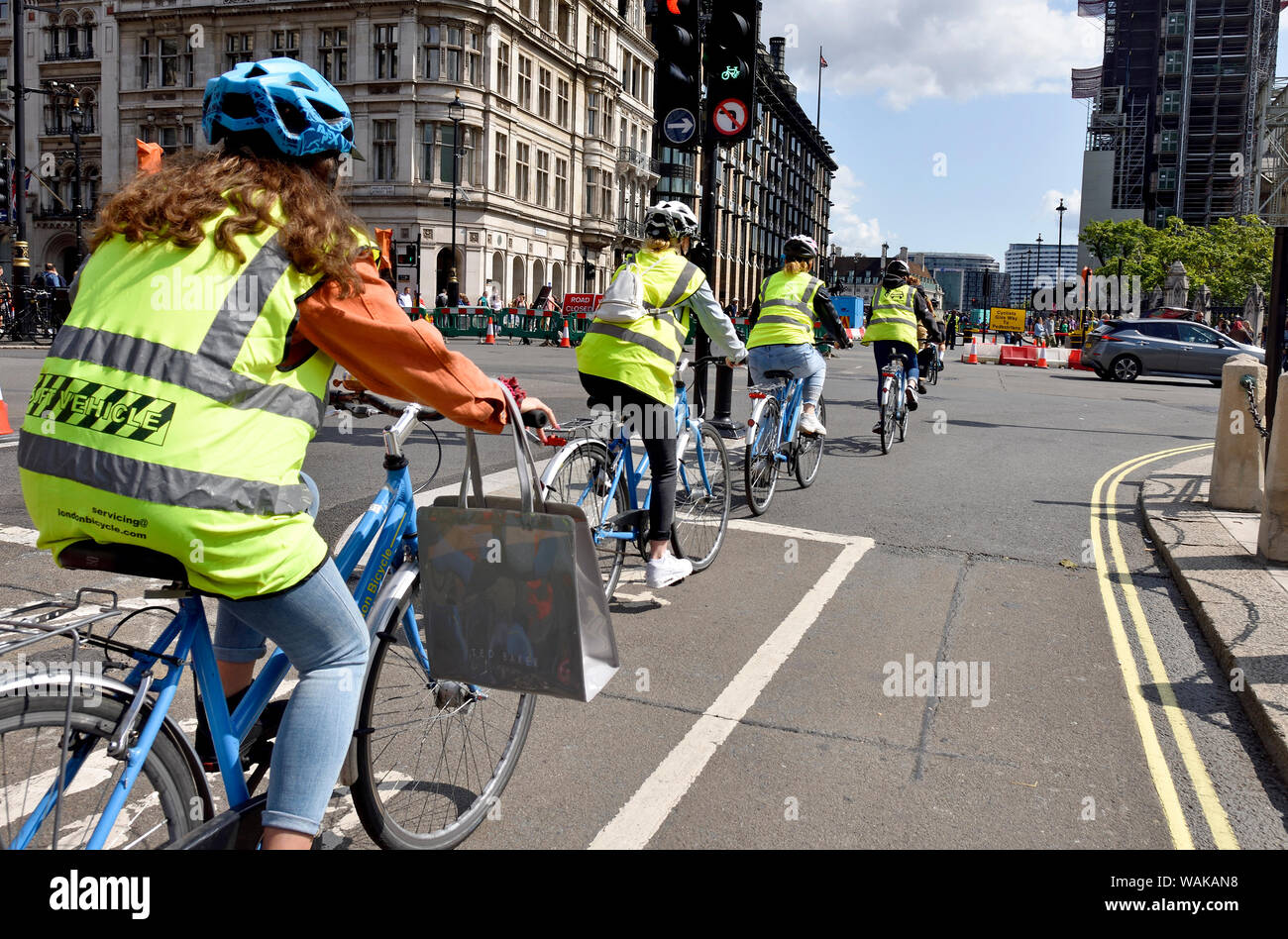London, England, UK. Children cycling in hi-vis vests in Parliament ...