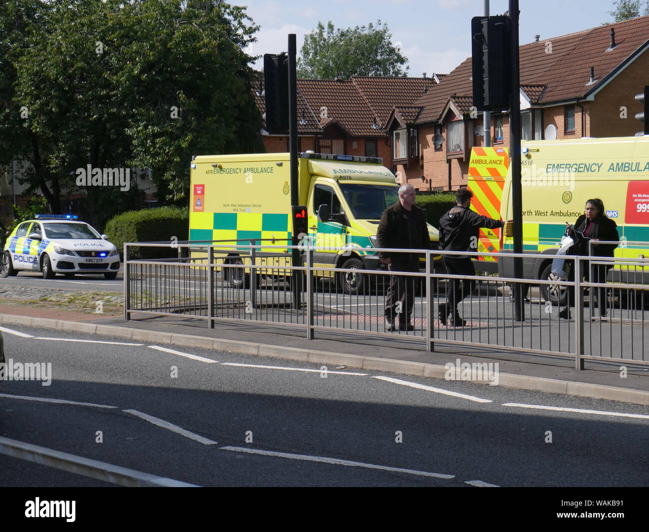 Ambulances at an accident scene on a pedestrian crossing on a dual ...