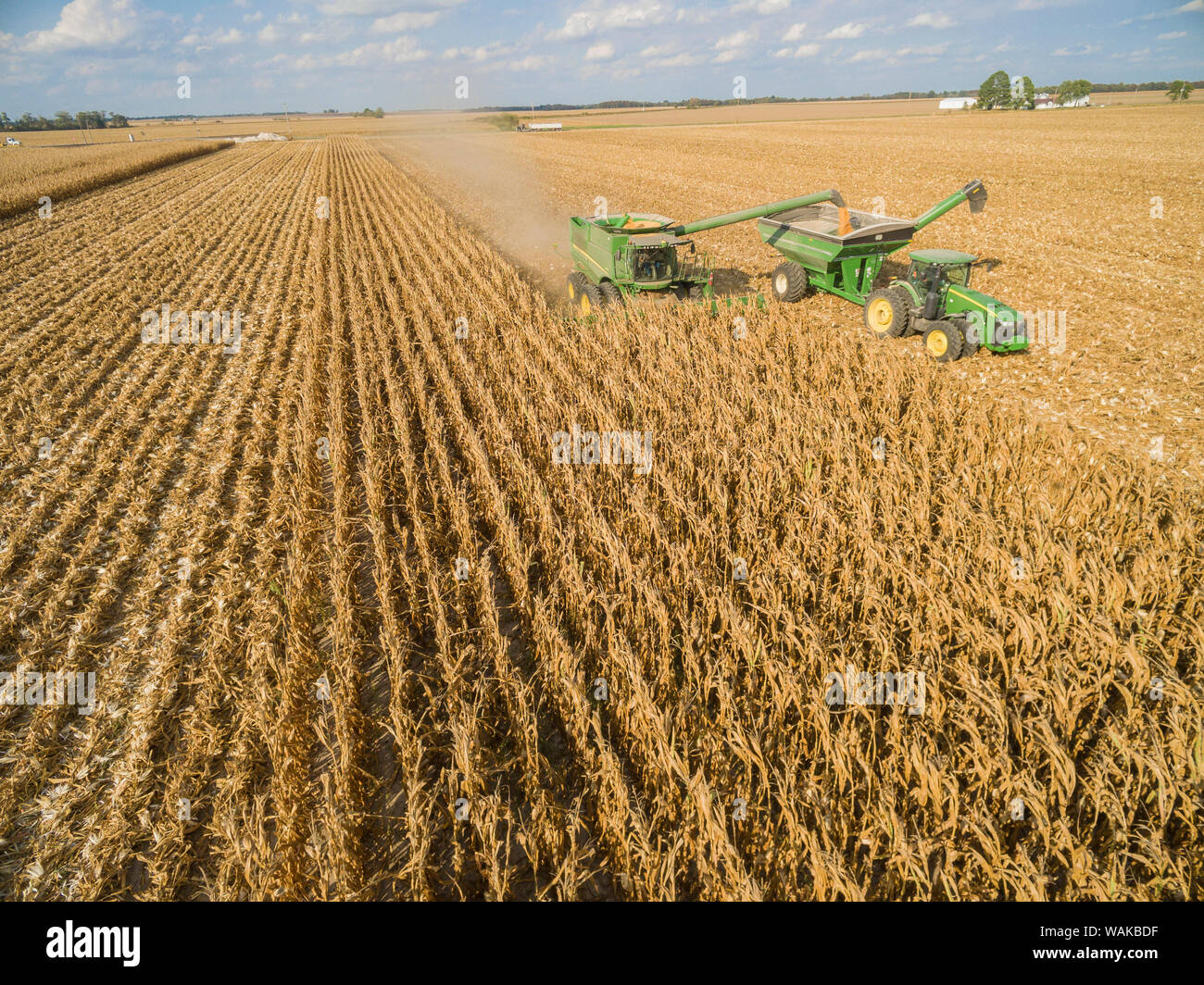 John Deere combine unloading corn into grain cart. Marion County ...
