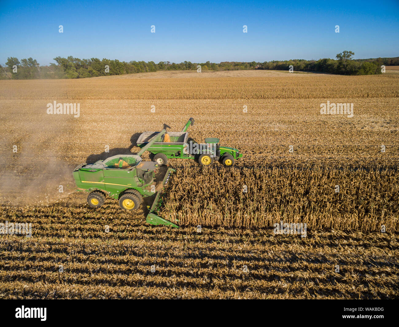 John Deere combine unloading corn into grain cart. Marion County ...