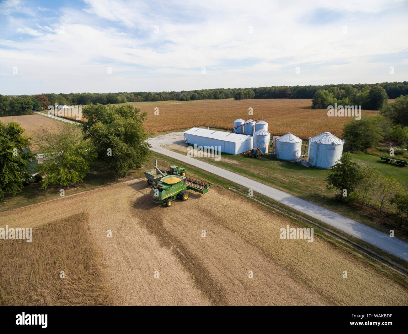 John Deere combine unloading soybeans into grain cart. Marion County ...