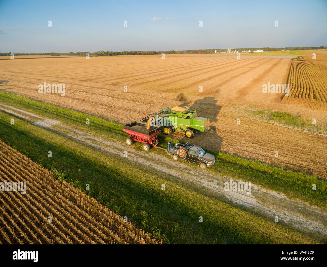 John Deere combine unloading soybeans into grain cart. Marion County ...