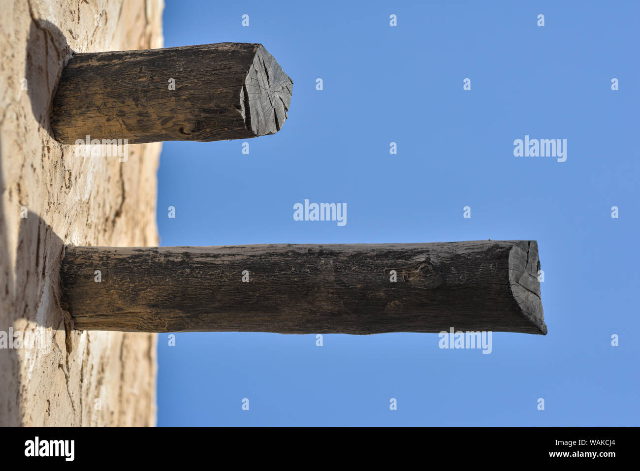 Close-up detail of structural wood posts taken in the afternoon in Souq ...