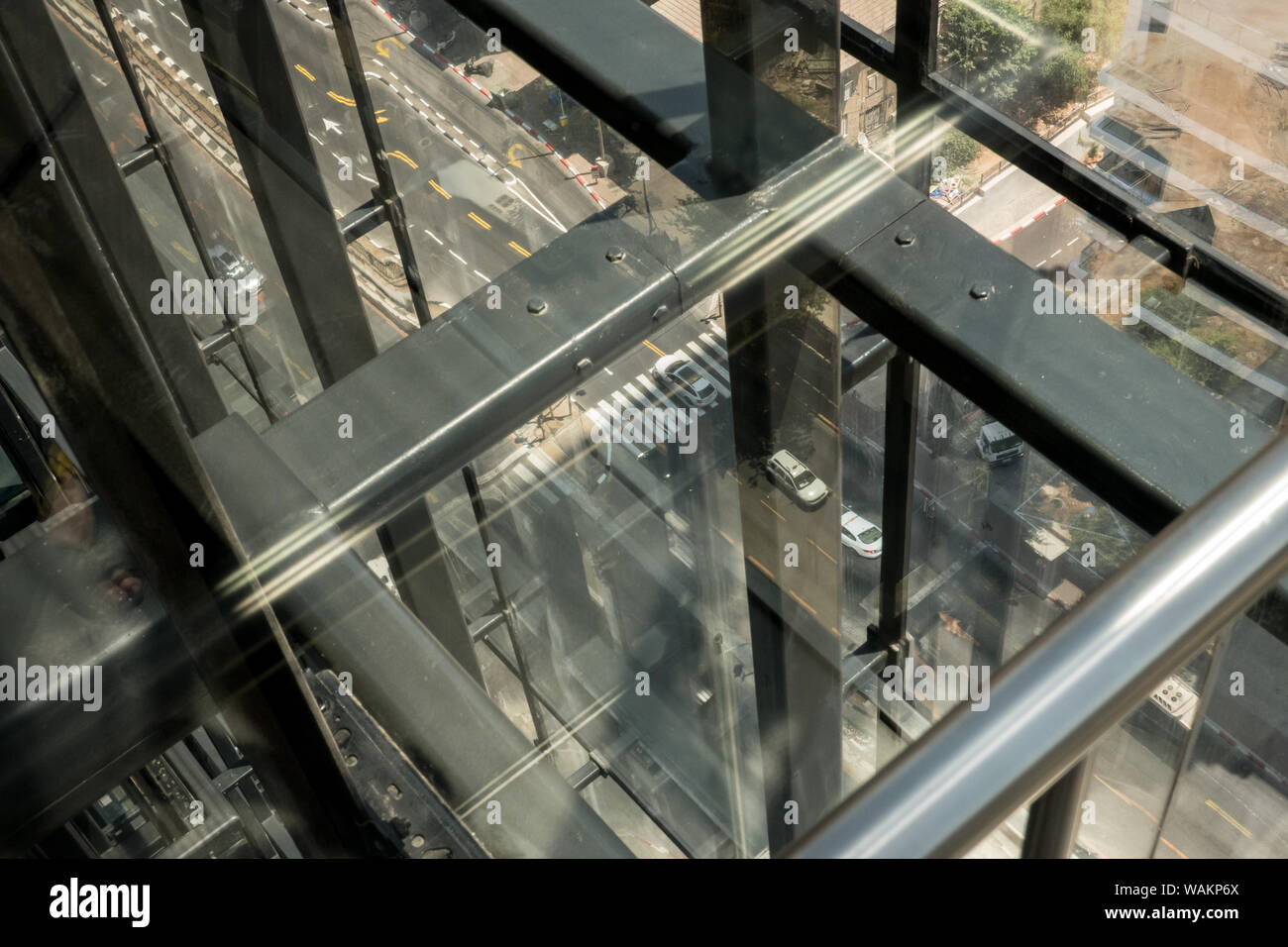 A view of the street below from a modern steel and glass tower Stock ...