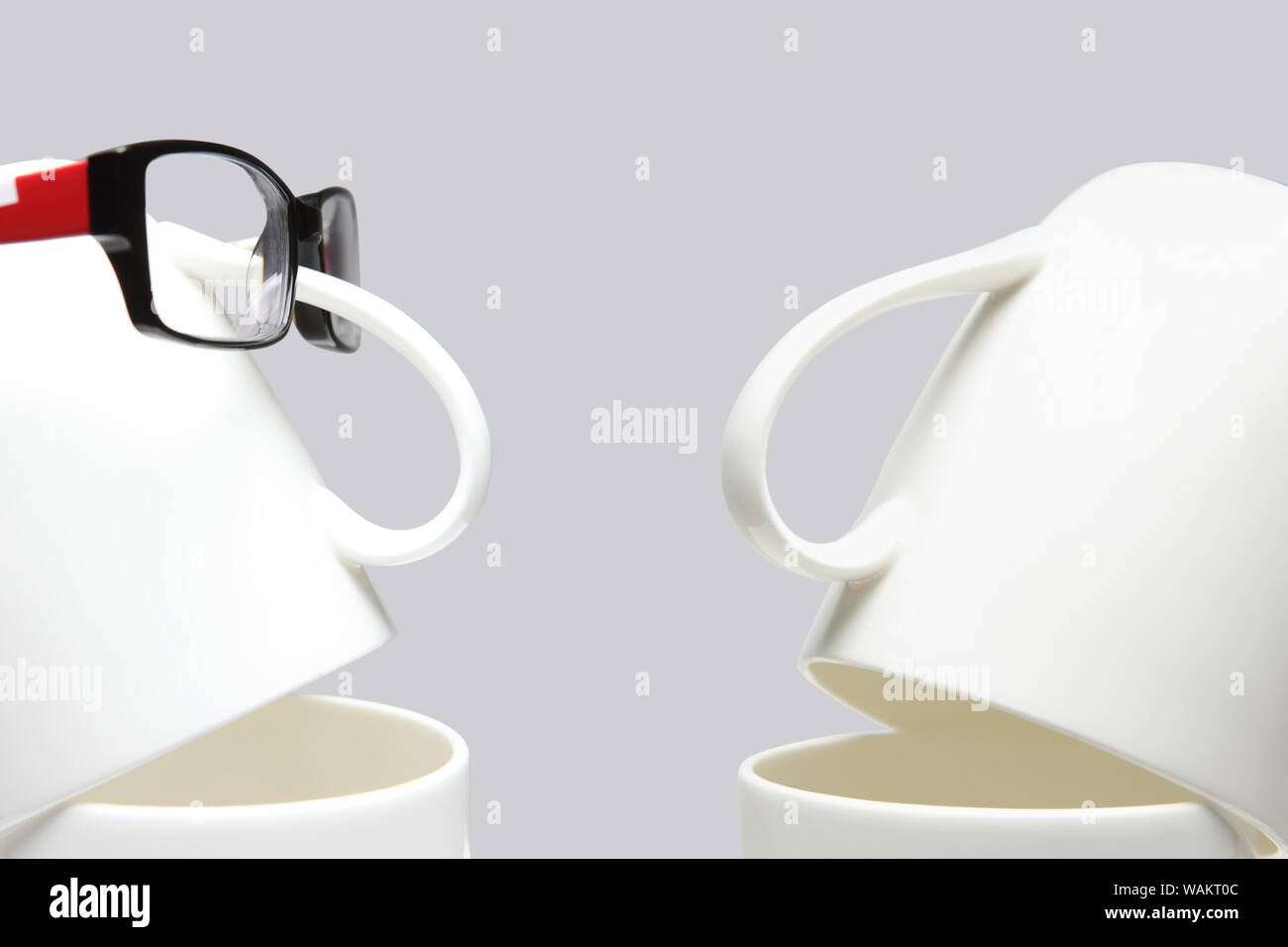 Cups representing human face Stock Photo - Alamy