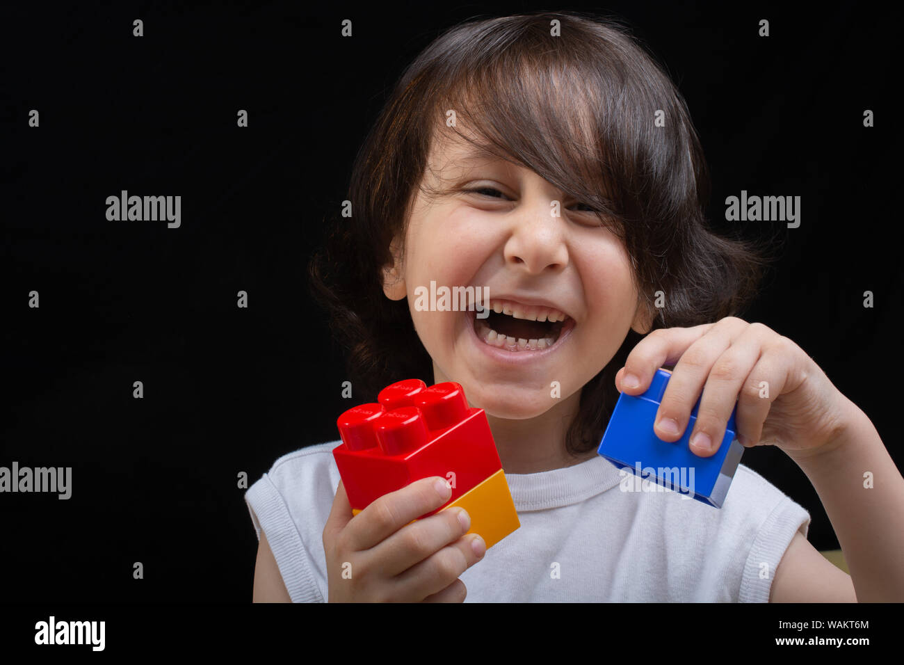 Children hands play with colorful building blocks lego blocks Stock ...